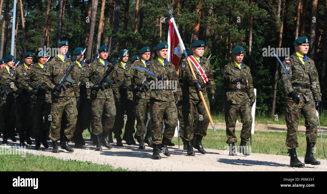 Soldiers with Battle Group Poland march into the opening ceremony of ...
