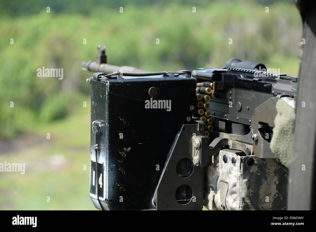A M240, mounted onto a UH-60 Black Hawk helicopter, over Fort Drum, N.Y ...