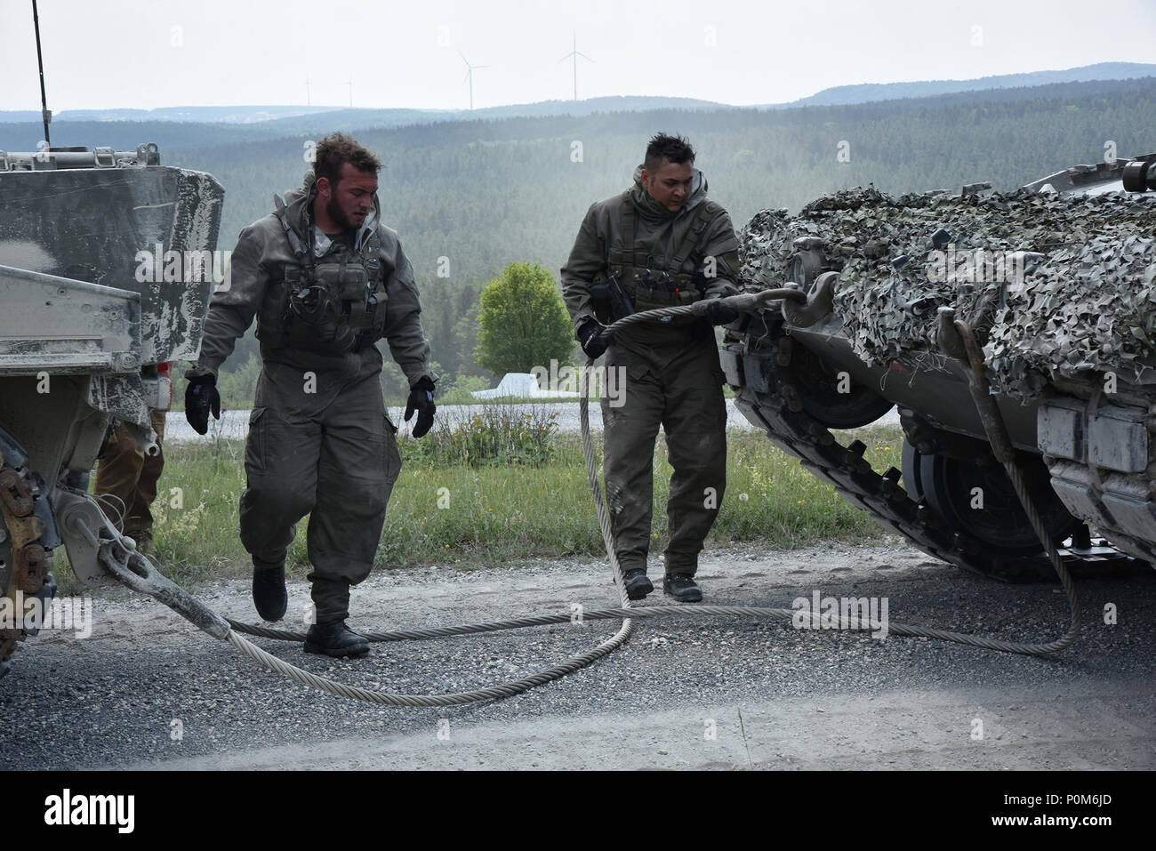 Tankers in Austria’s 6th Tank Company, 14th Panzer Battalion react to a ...