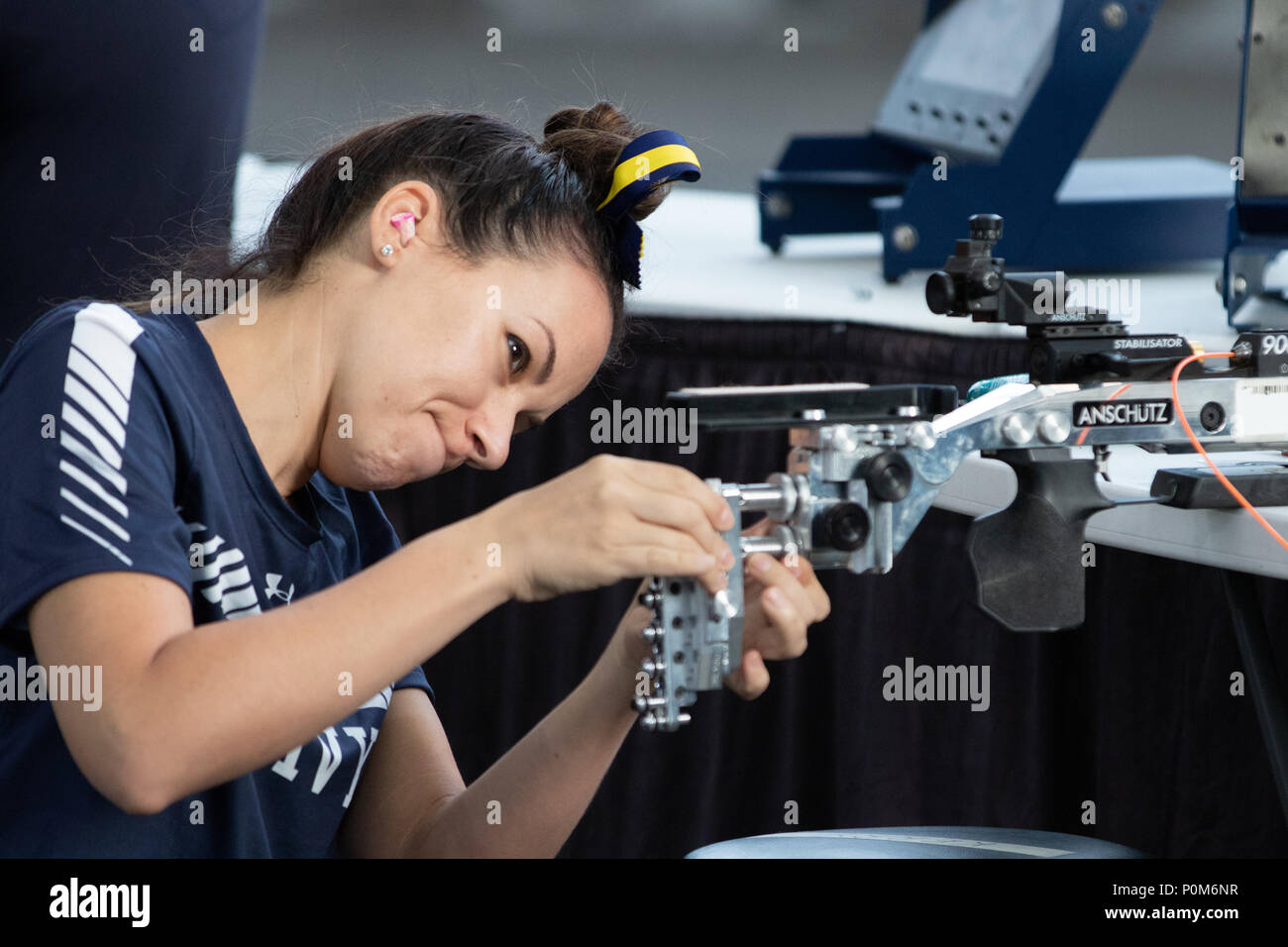 Lieutenant Anna Kerry makes last minute adjustments to her air rifle ...