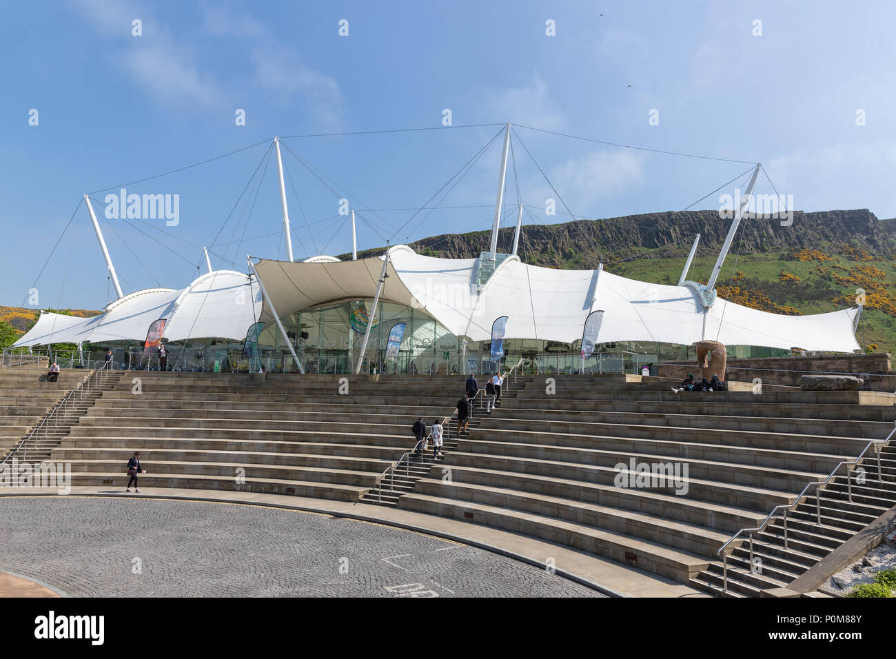 People climbing stairs of science museum Dynamic Earth in Edinburgh ...