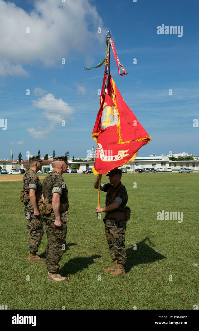 CAMP FOSTER, OKINAWA, Japan – Sgt. Maj. George Garcia delivers colors ...