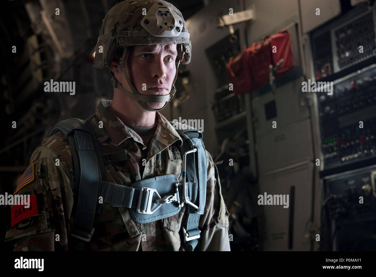 An U.S. Army Soldier, gives British Army paratroopers assigned to the ...