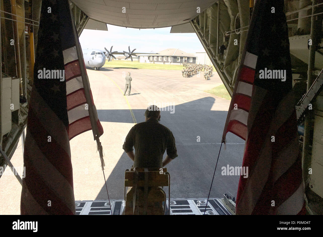 A loadmaster from the 86th Airlift Wing is seen on the rear ramp of C ...