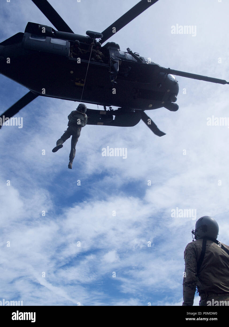 Crew of a 210th Rescue Squadron HH-60G Pave Hawk hoist Chief Master Sgt ...