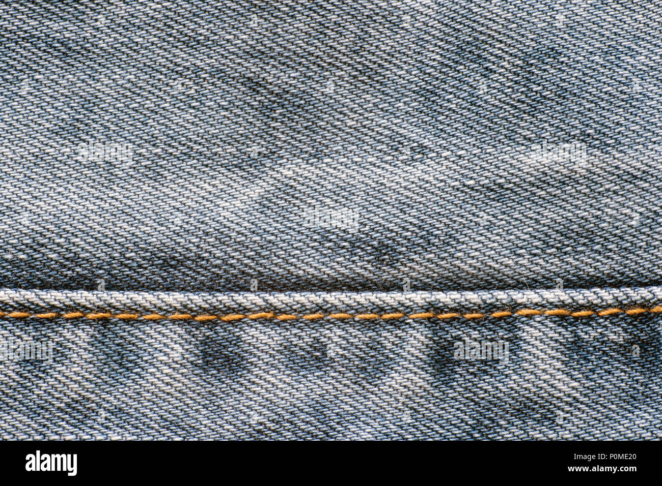 texture of denim, seam of yellow thread, background Stock Photo - Alamy