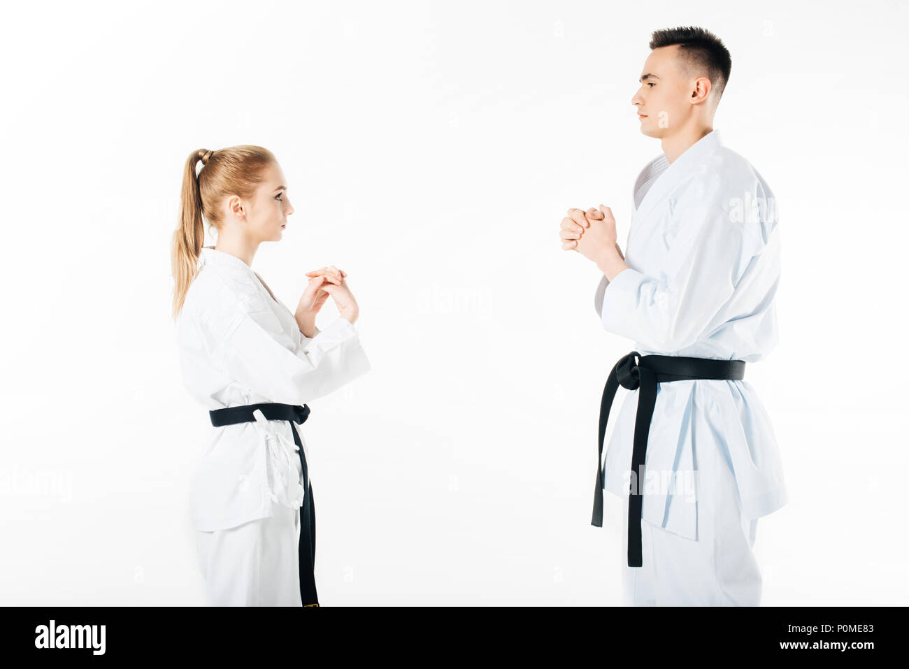 karate fighters stretching fingers isolated on white Stock Photo - Alamy