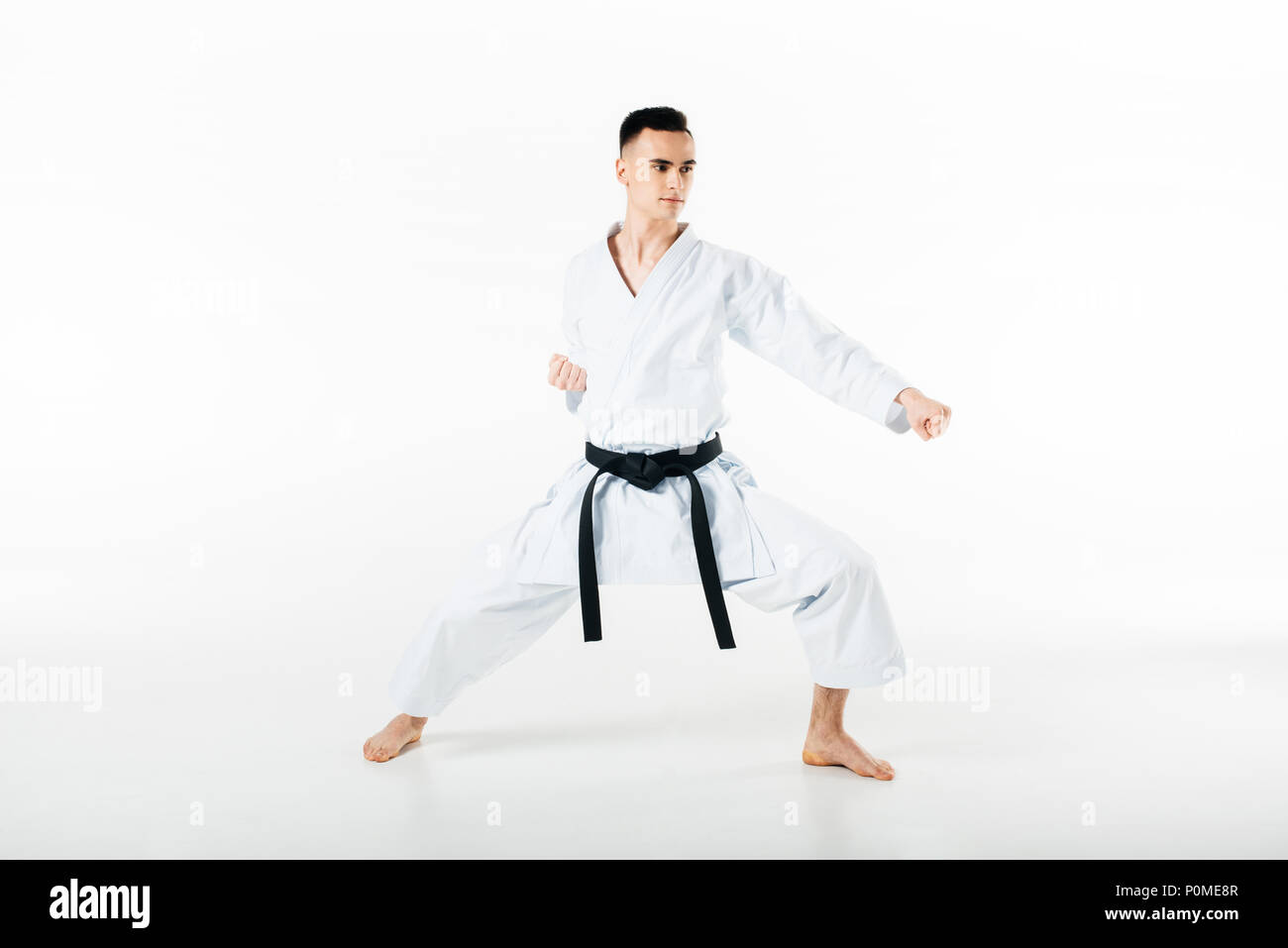 male karate fighter training isolated on white Stock Photo - Alamy