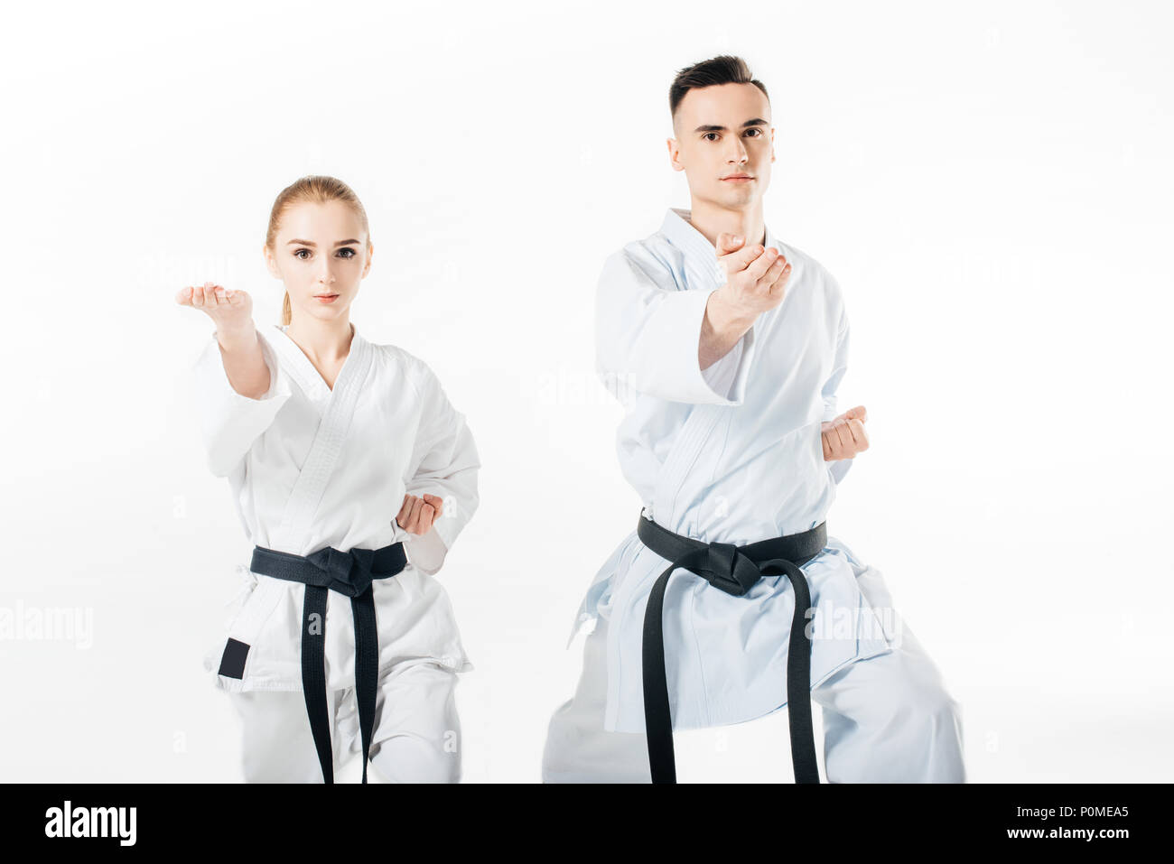 karate fighters with black belts training isolated on white Stock Photo ...