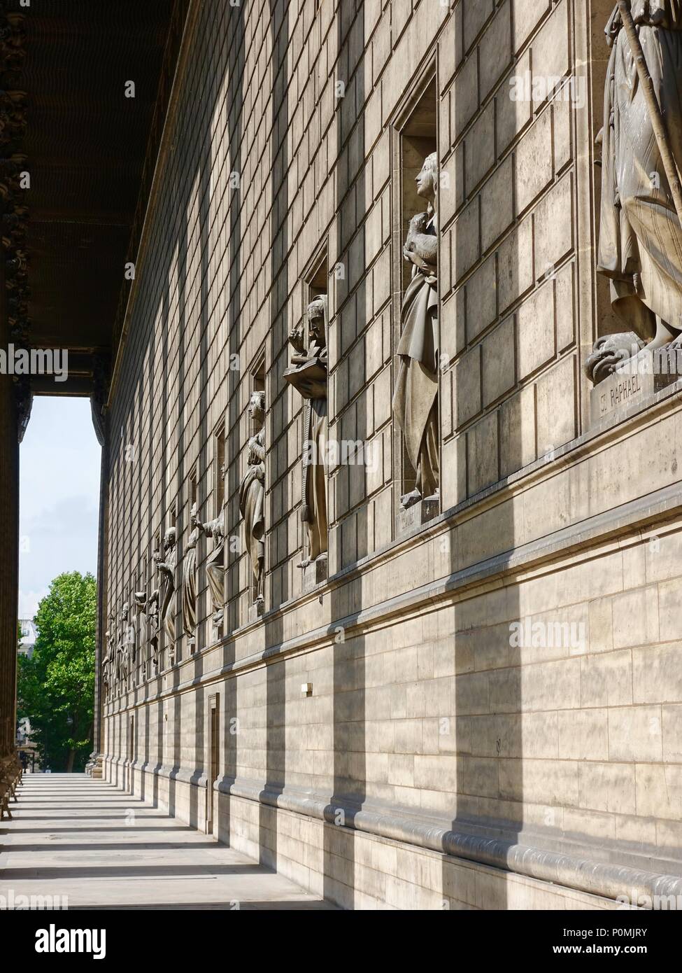 Massive stone pillars cast shadows along the eastern portico of the ...