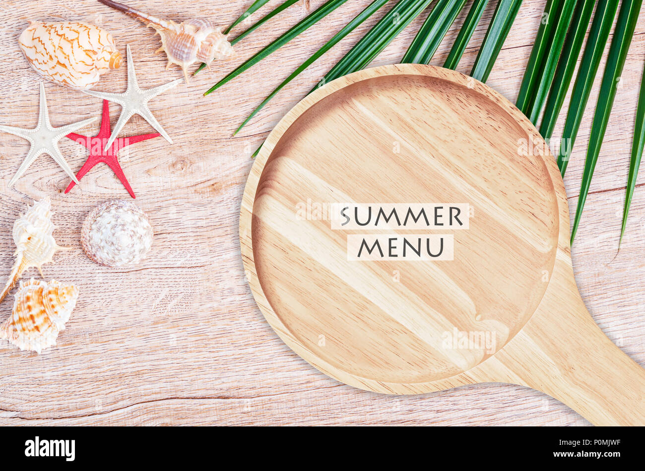 Summer menu written on wooden plate with summertime background Stock ...