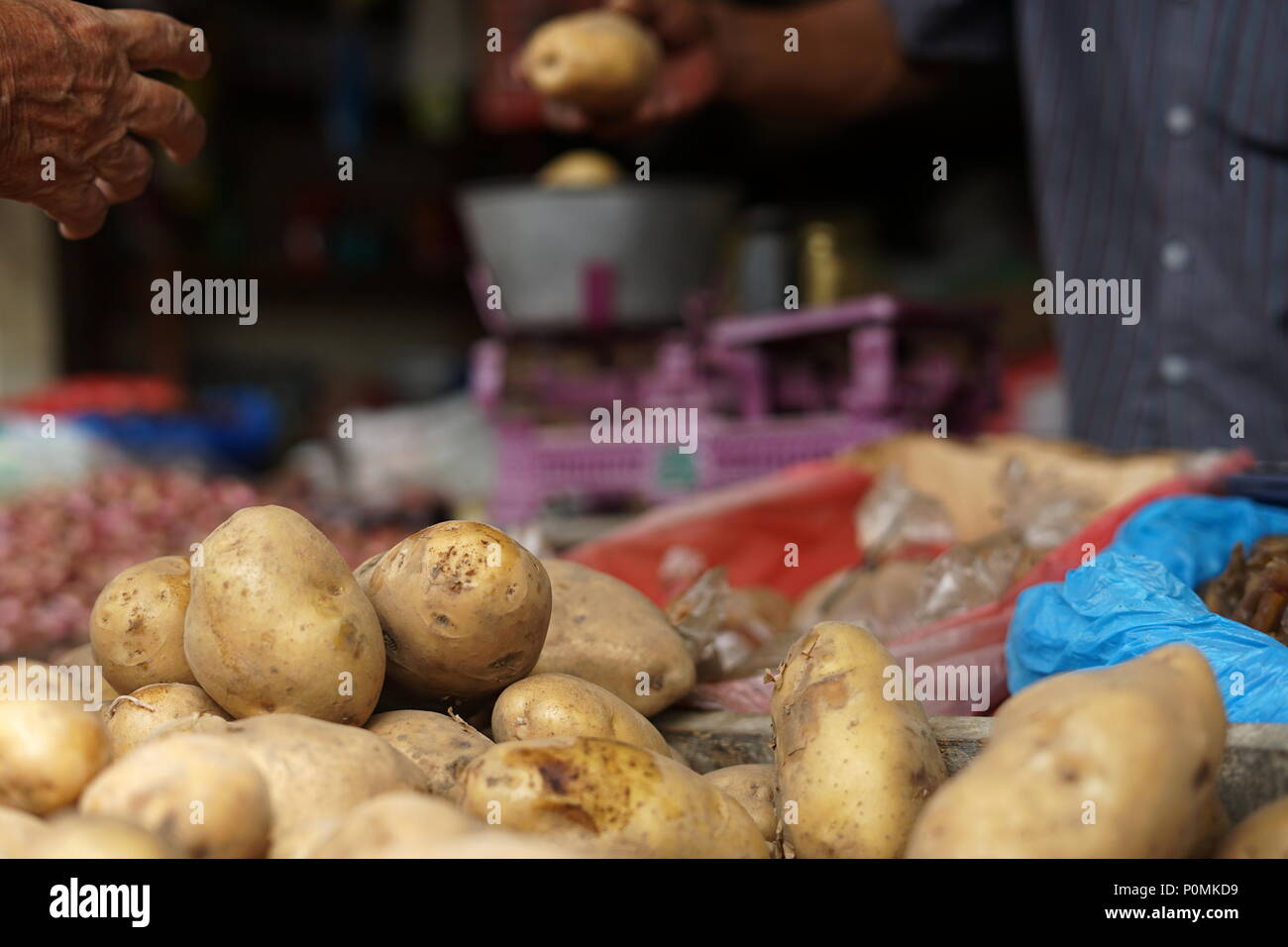 Vegetable vendor selling Fresh Potato on a Street food market in Banda ...
