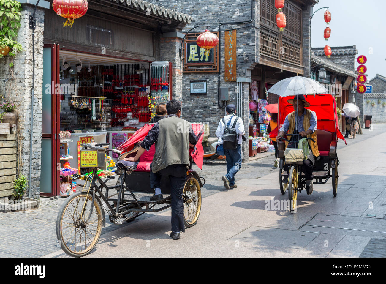 Chinese pedicabs hi-res stock photography and images - Alamy