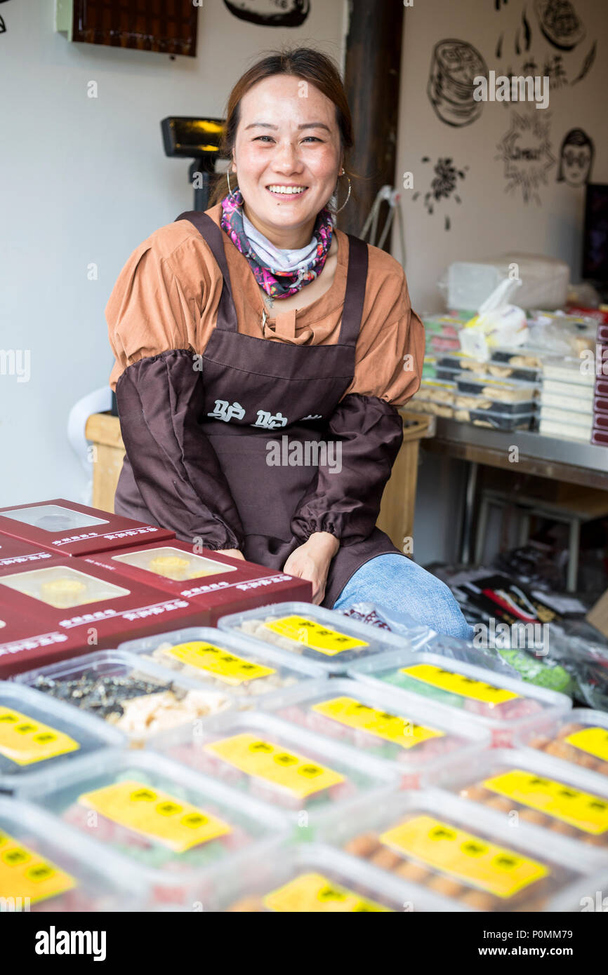 Woman selling snacks hi-res stock photography and images - Alamy