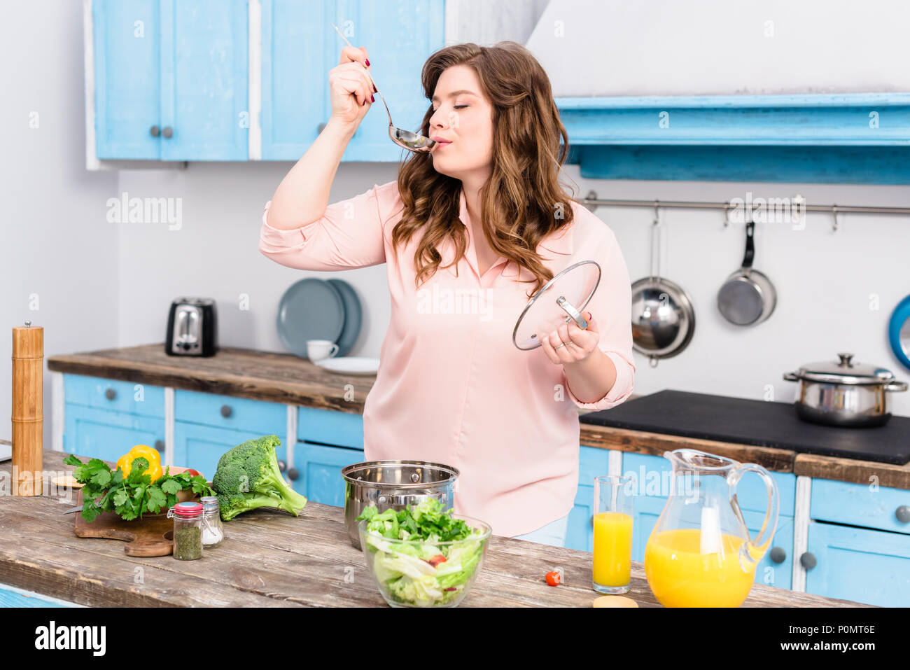 Overweight adult meal preparation hi-res stock photography and images ...