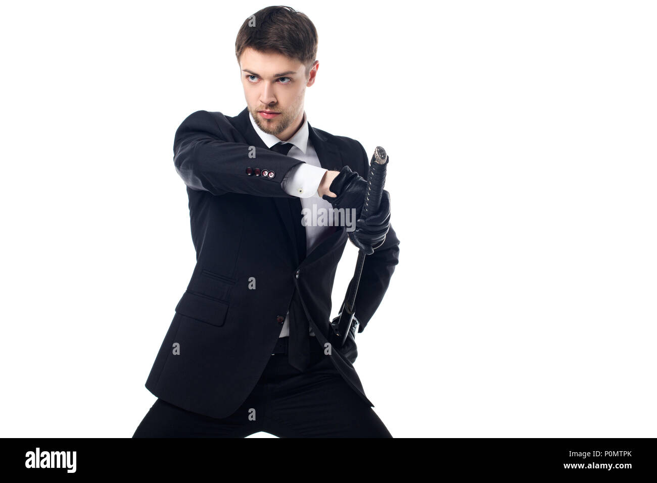 confident agent in suit and gloves with katana isolated on white Stock ...
