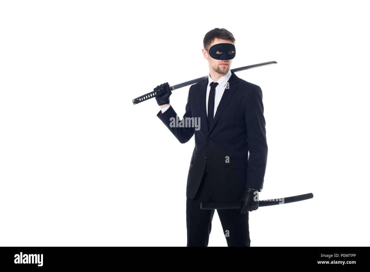 spy agent in mask and gloves with katana looking away isolated on white ...