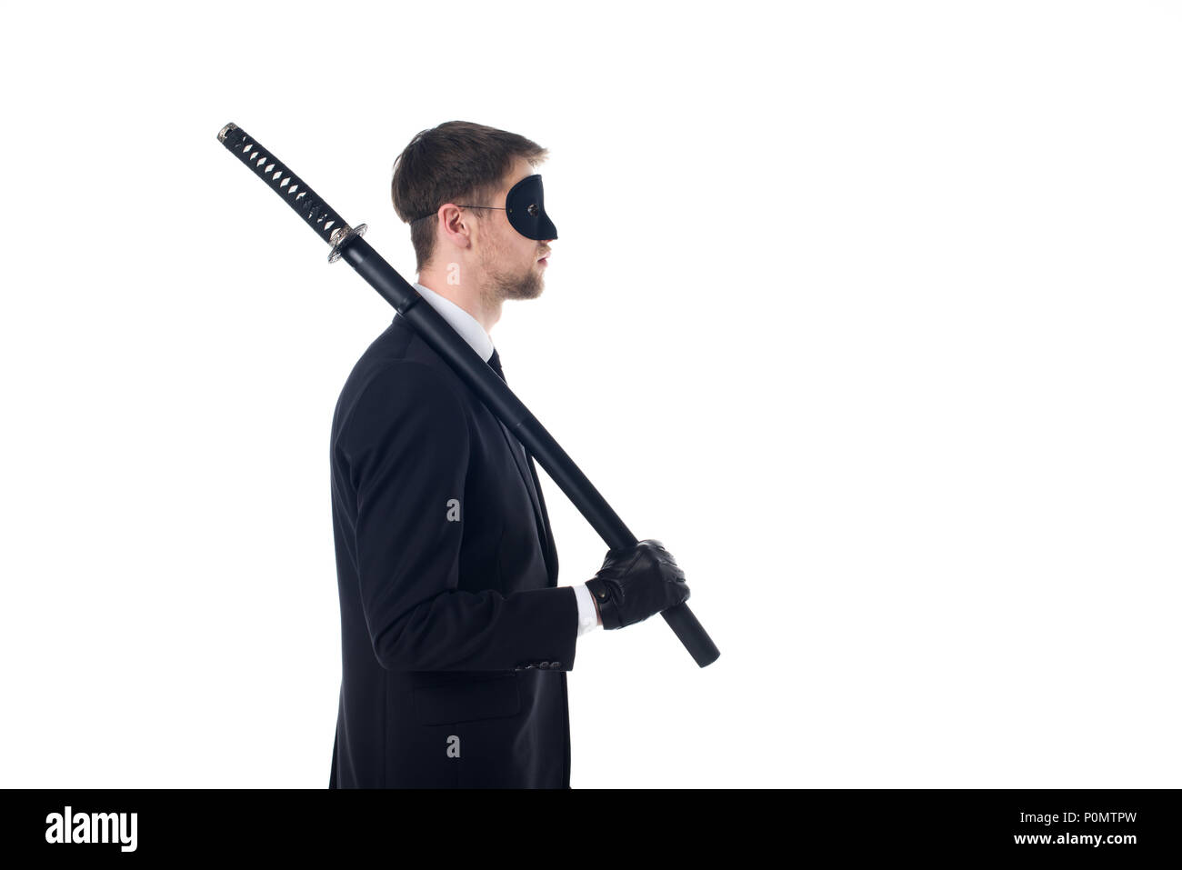side view of spy agent in mask and gloves with katana isolated on white ...
