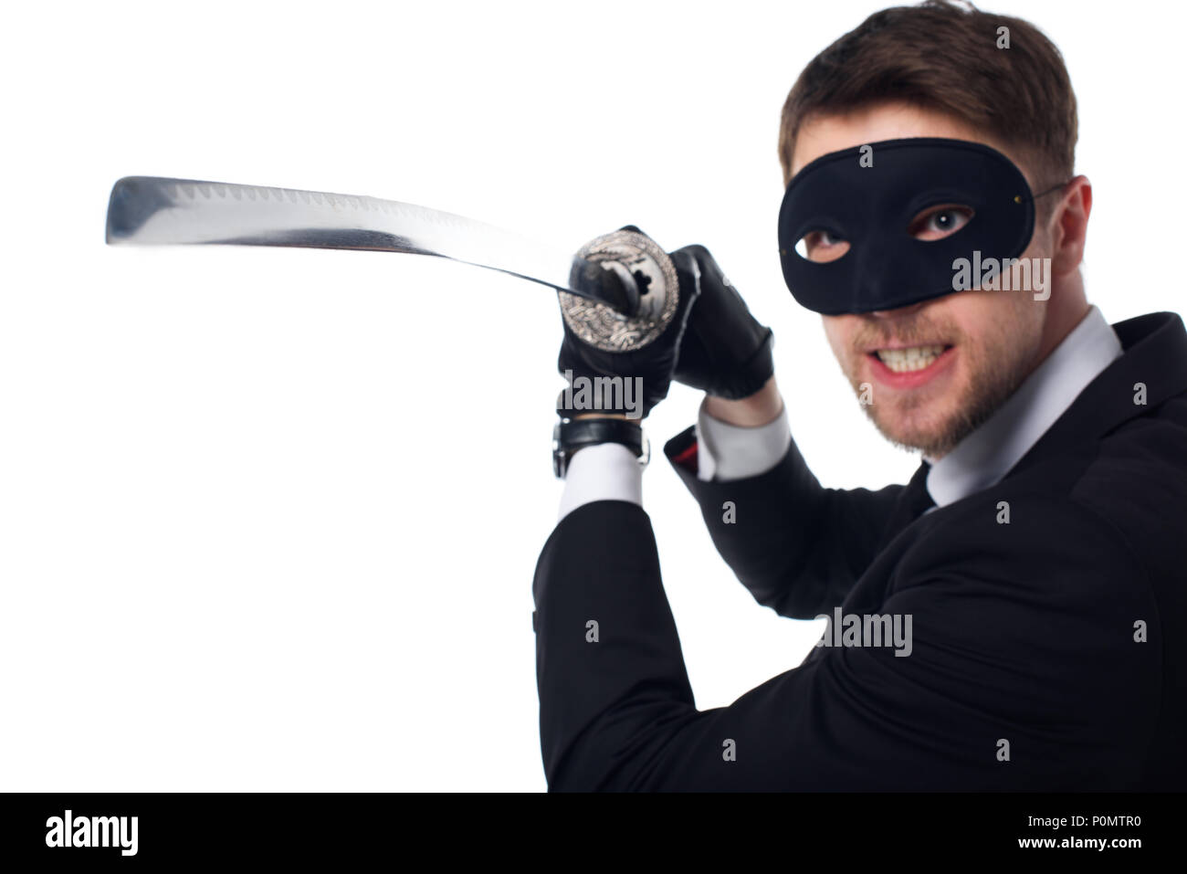 portrait of emotional spy agent in mask and gloves with katana isolated ...