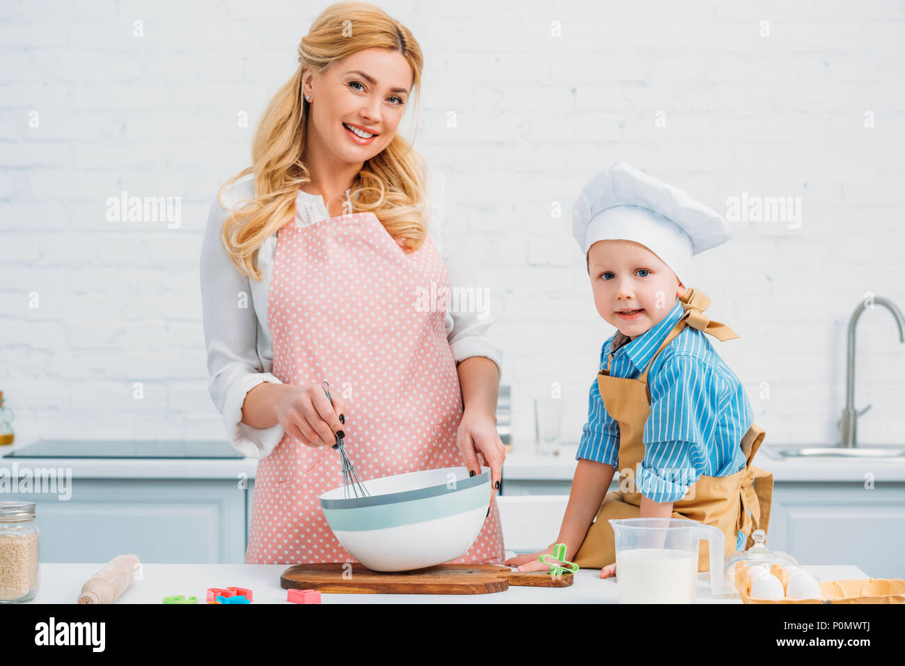 Little boy and mother cooking together in kitchen Stock Photo - Alamy