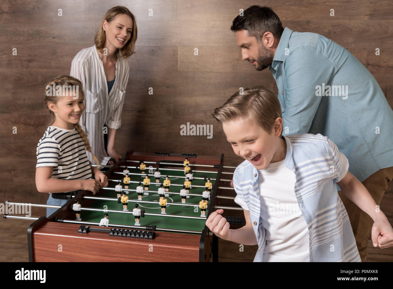 Family Playing Foosball
