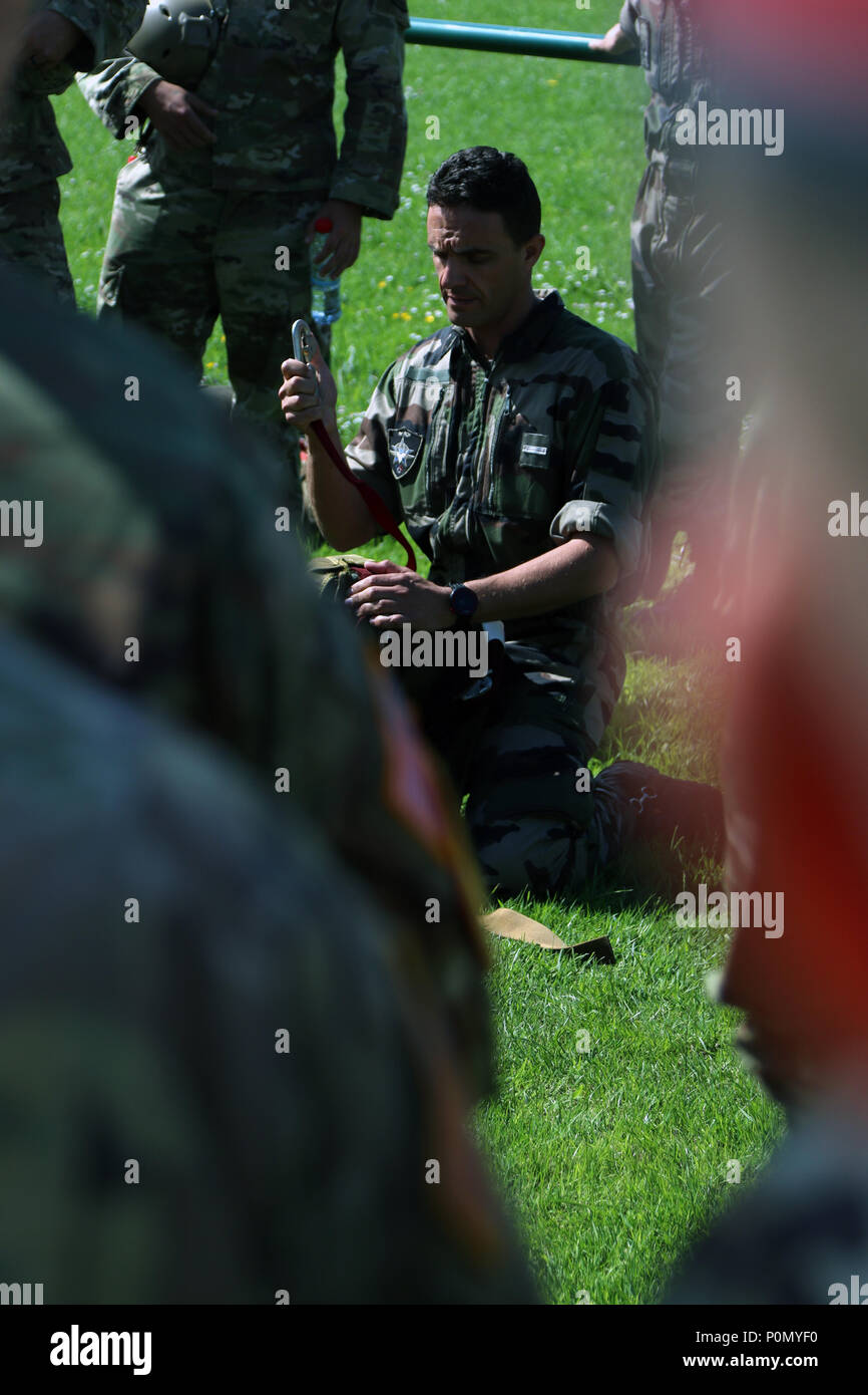 A French jumpmaster (center) shows paratroopers of the 82nd Airborne ...