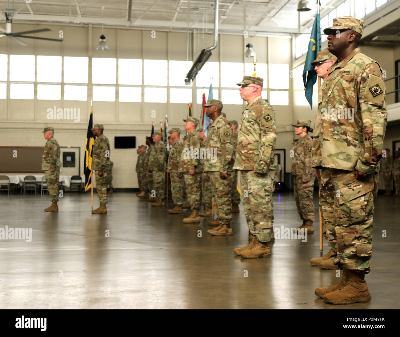 Units of 66th Troop Command stand at attention during a promotion and ...