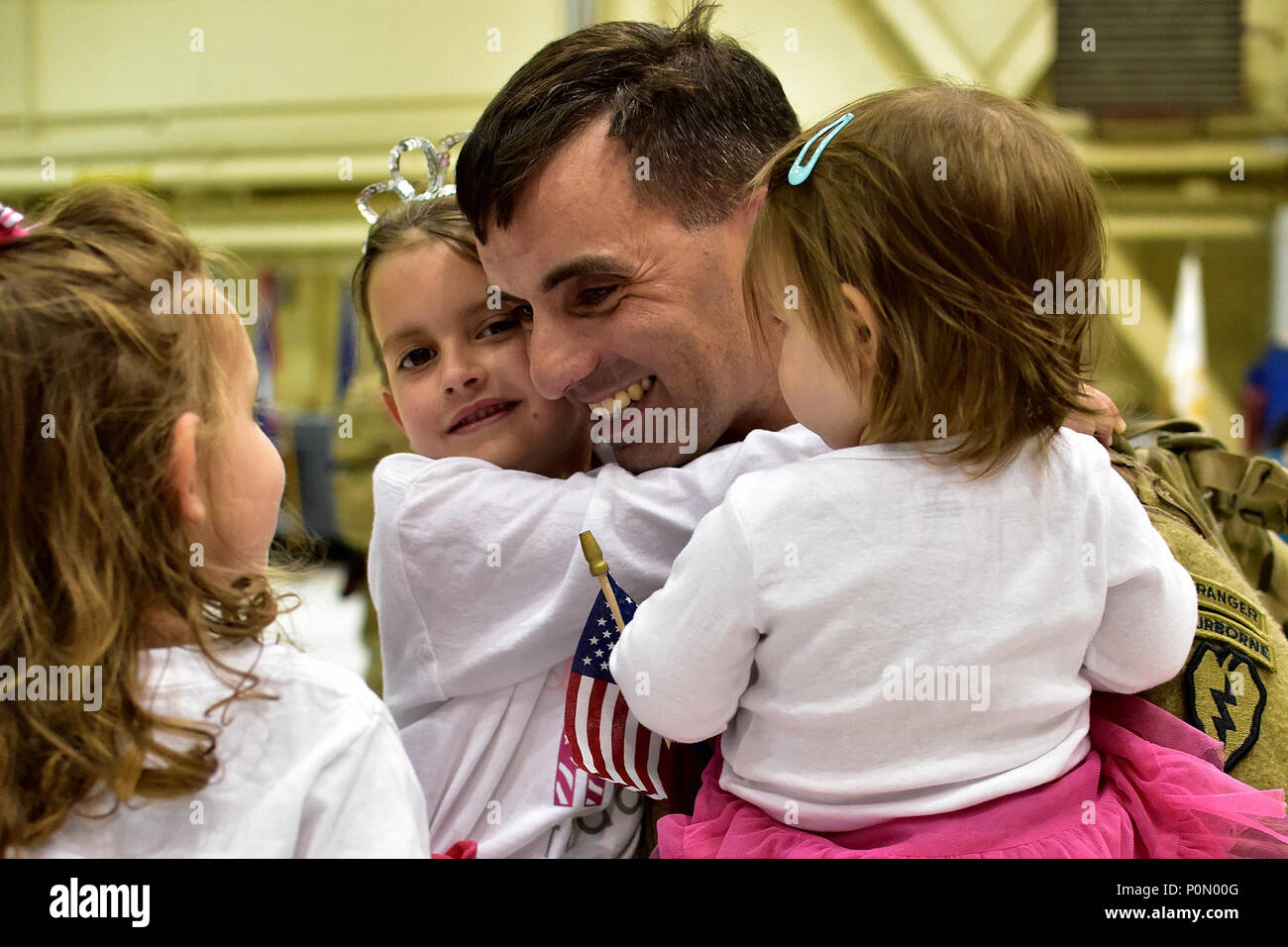 Capt. John Tilley is greeted by his daughters, Frances, 1, and Margaret ...