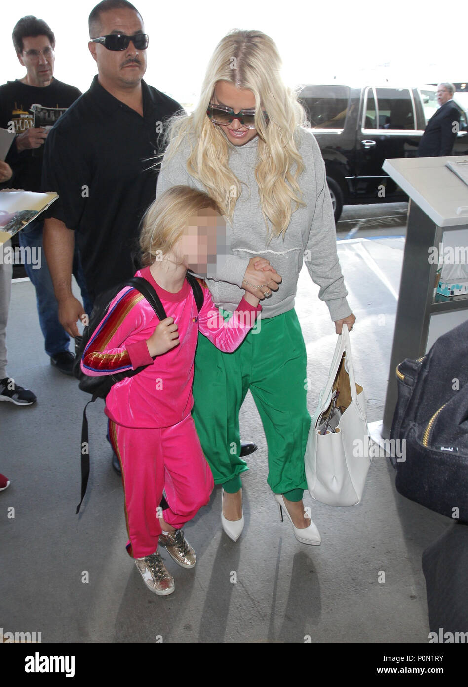 Jessica Simpson and Eric Johnson arrive at LAX airport in Los Angeles ...