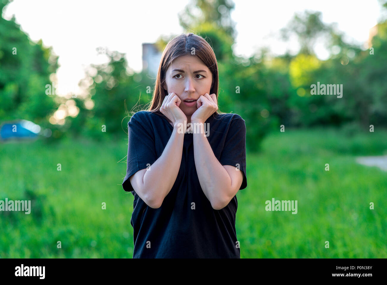 Beautiful brunette girl in summer in a park on nature. Emotional ...