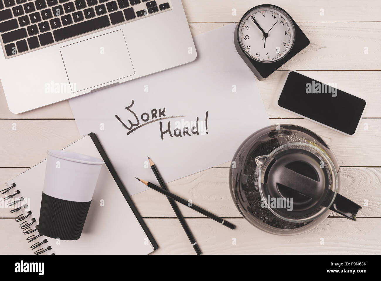 laptop, coffee pot, paper cup, clock, smartphone and inscription work ...