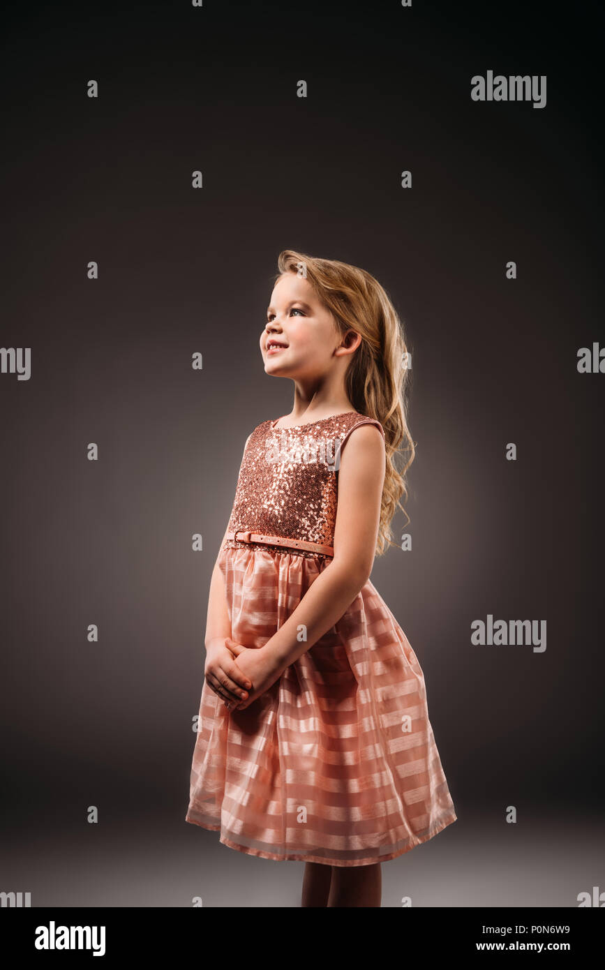 adorable princess in pink dress, isolated on grey Stock Photo - Alamy