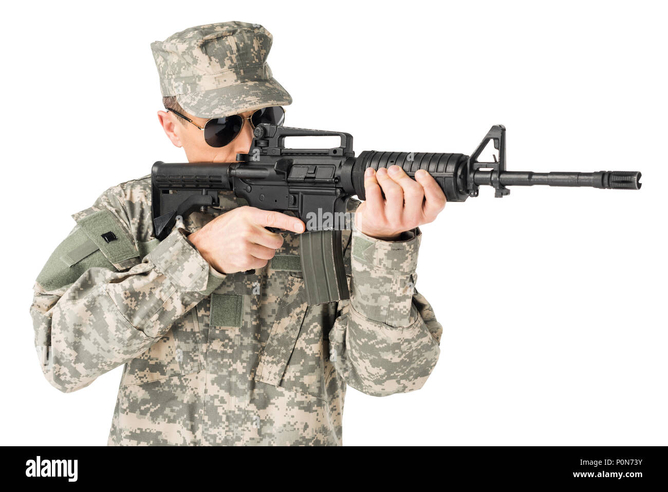 Handsome army soldier wearing uniform aiming with gun isolated on white ...
