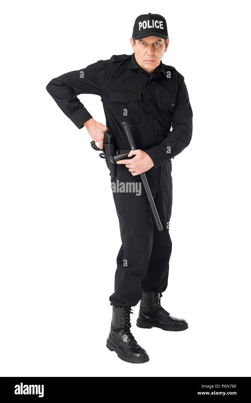 Confident policeman in uniform pulling out gun isolated on white Stock ...