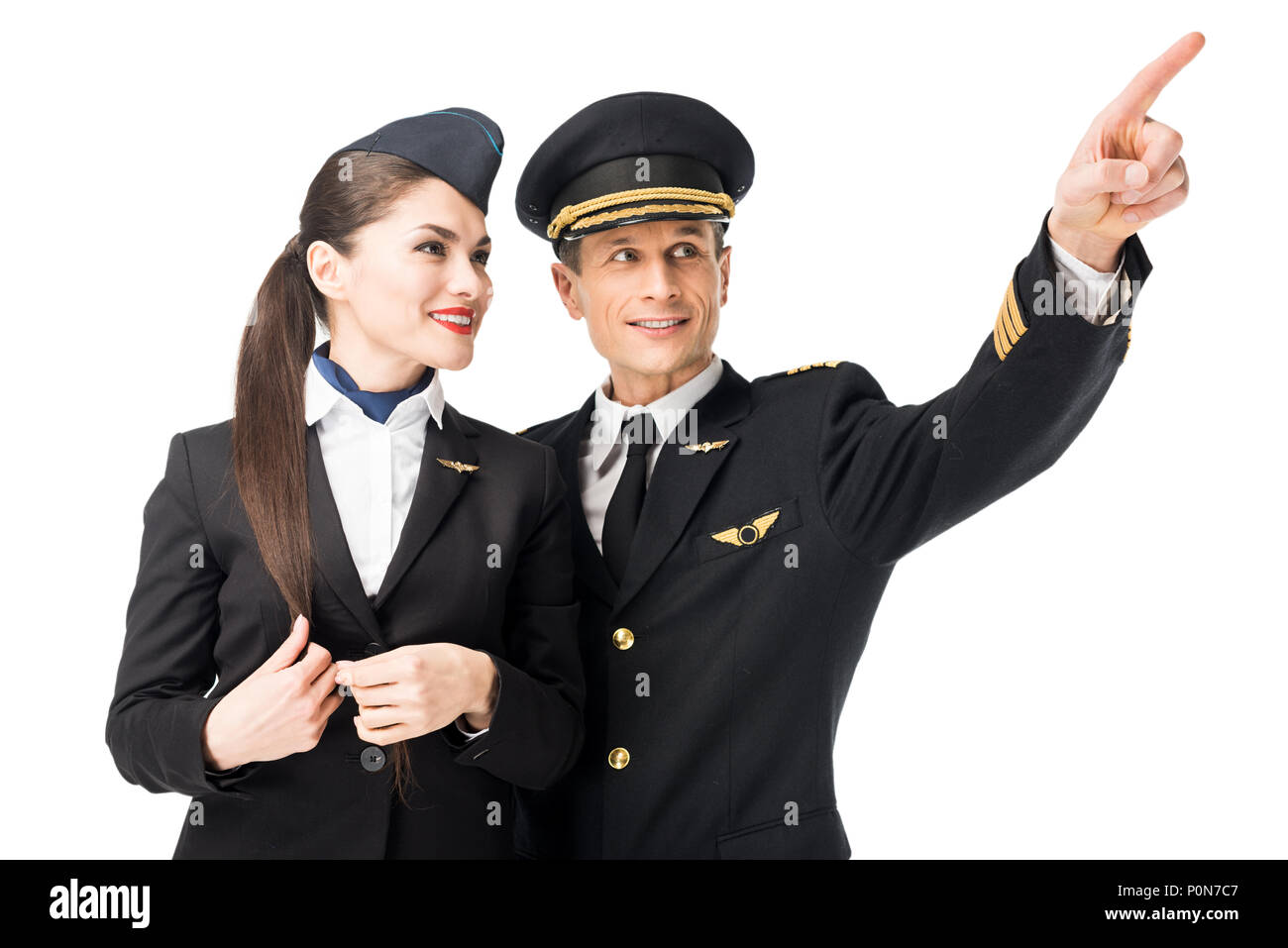 Pilot pointing showing stewardess something isolated on white Stock ...