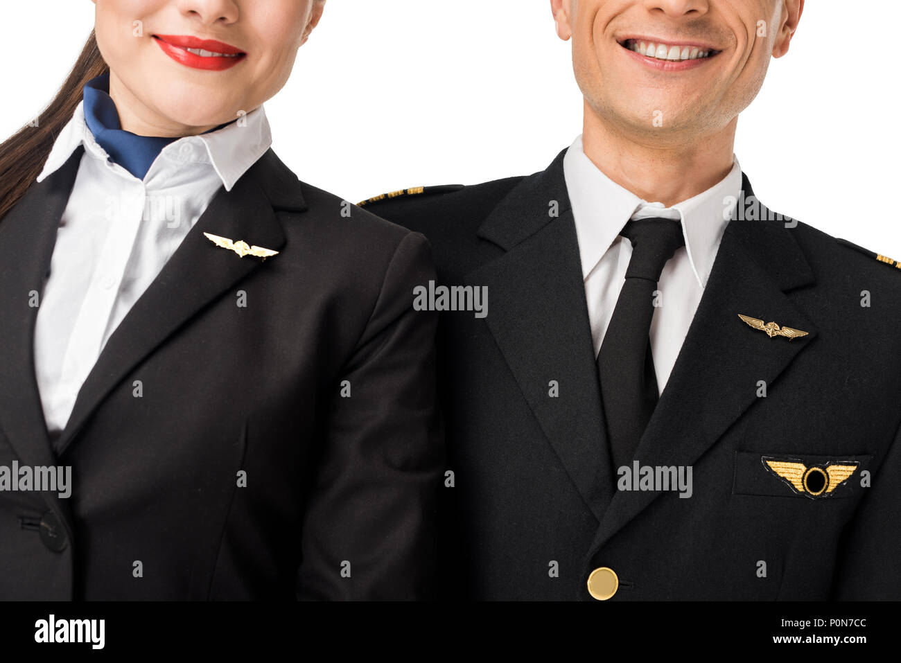Close-up view of stewardess and pilot in uniform isolated on white ...