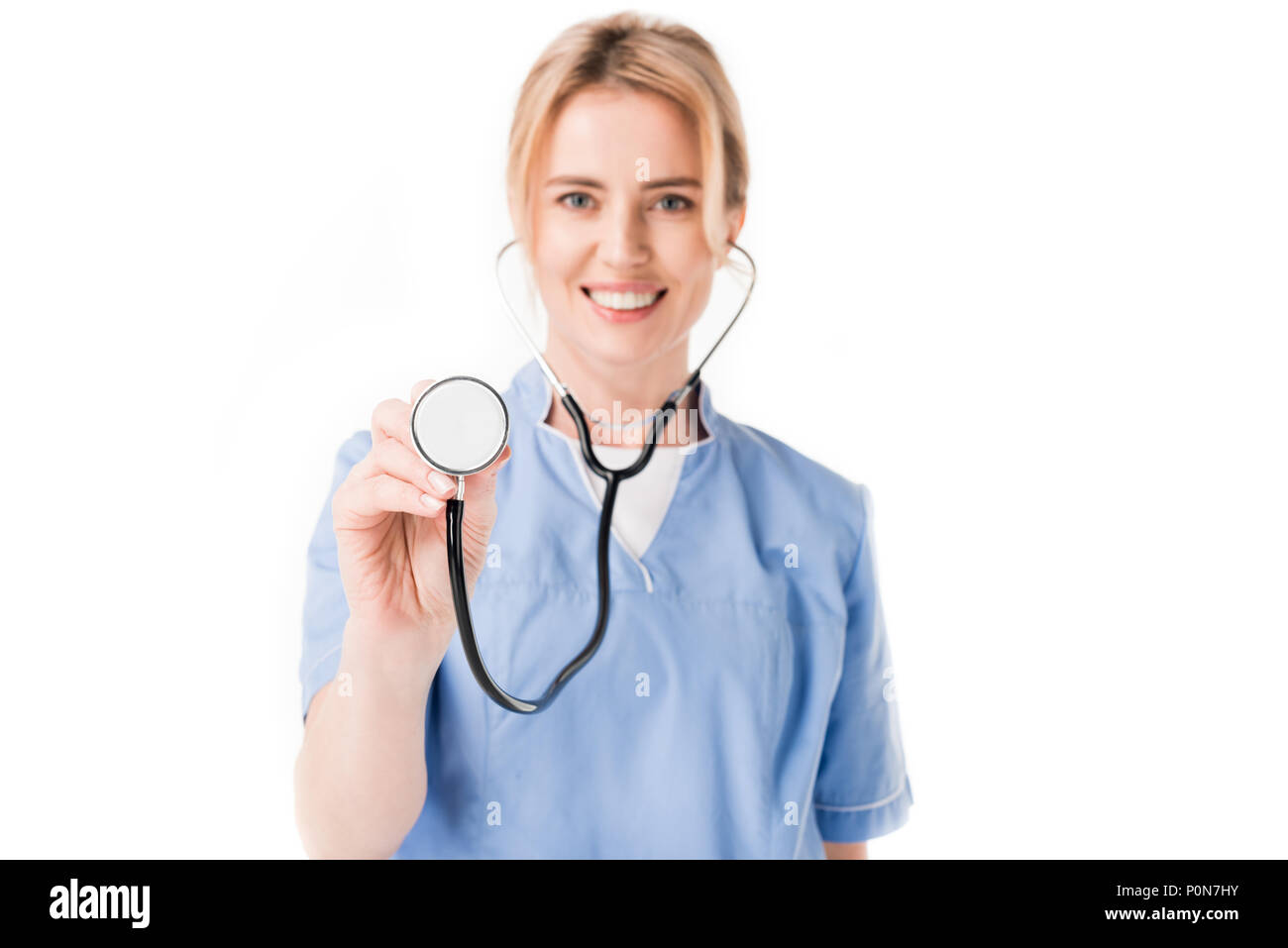 Young nurse using stethoscope isolated on white Stock Photo - Alamy