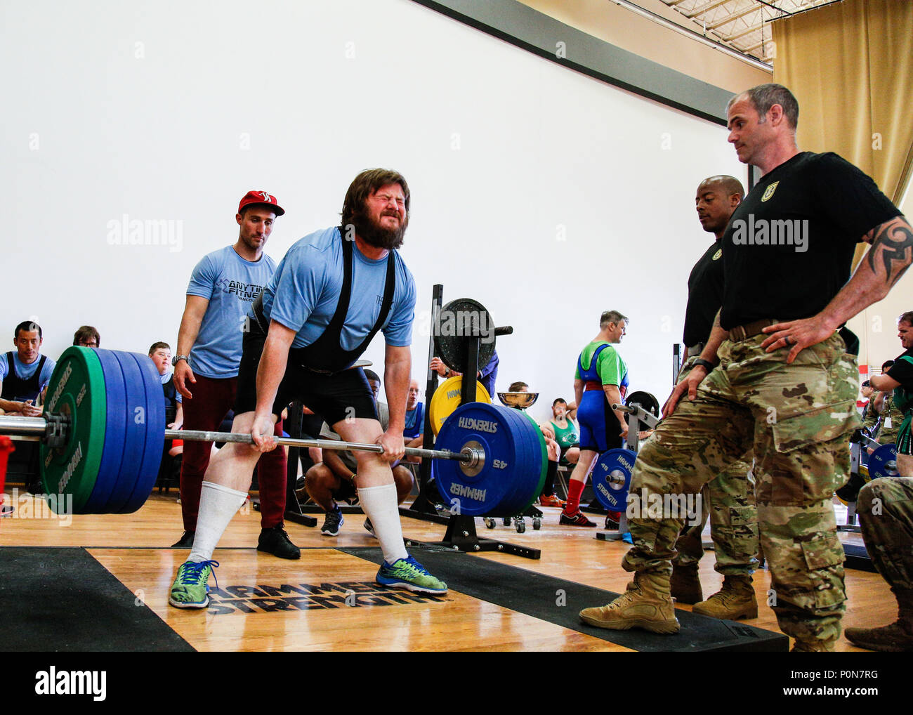 Volunteers from 1st Special Forces Group (Airborne) encourage a Special ...