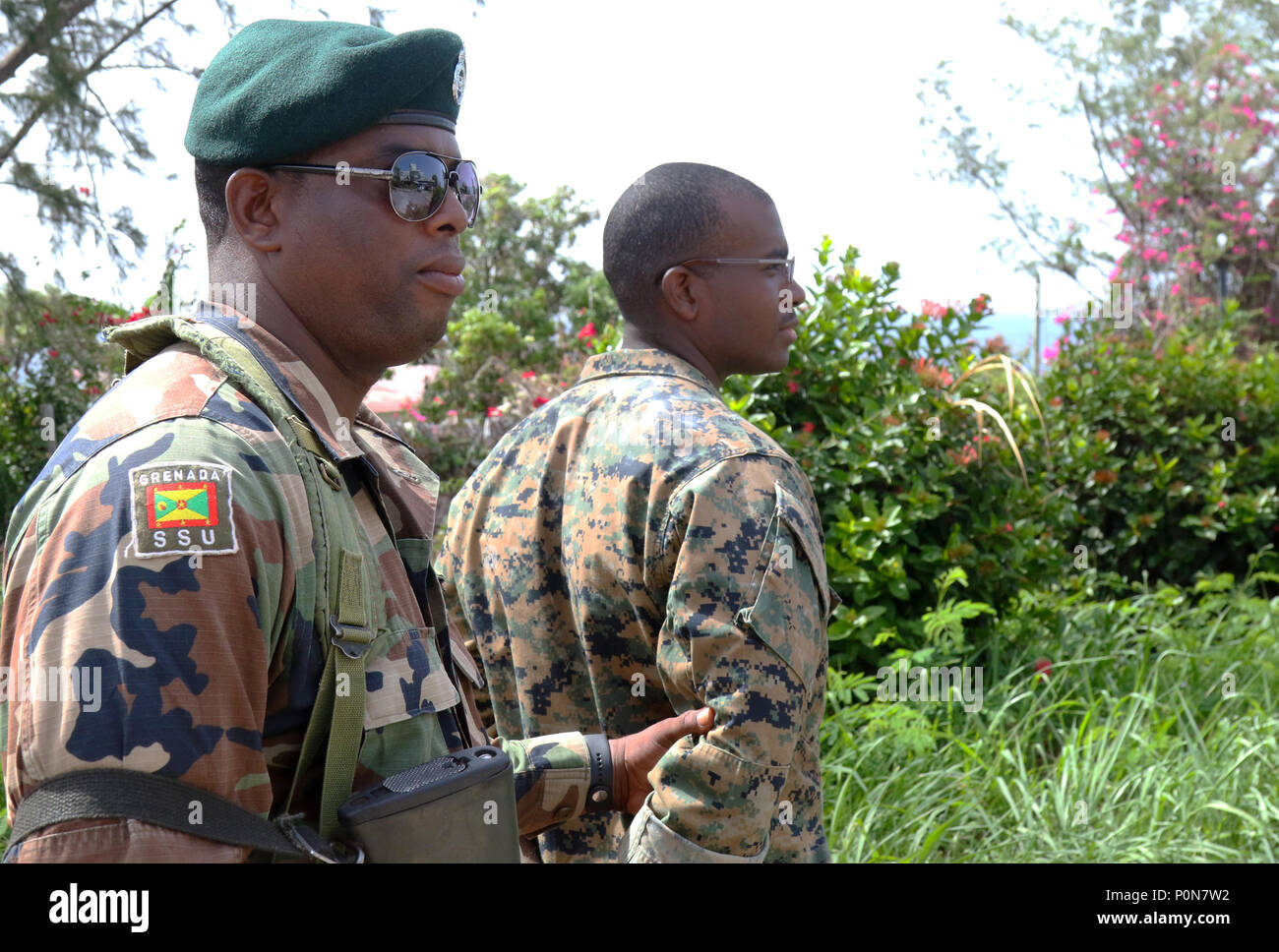 Morris Richardson, a constable with the Grenada Special Service Unit, detains Marine Lance Cpl ...
