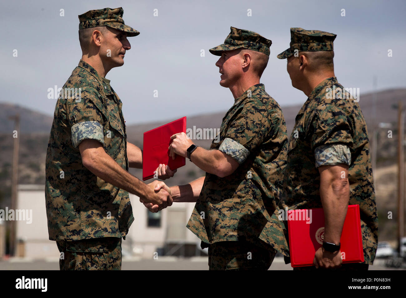 Col. Jeffrey C. Holt, center, commanding officer, School of Infantry ...