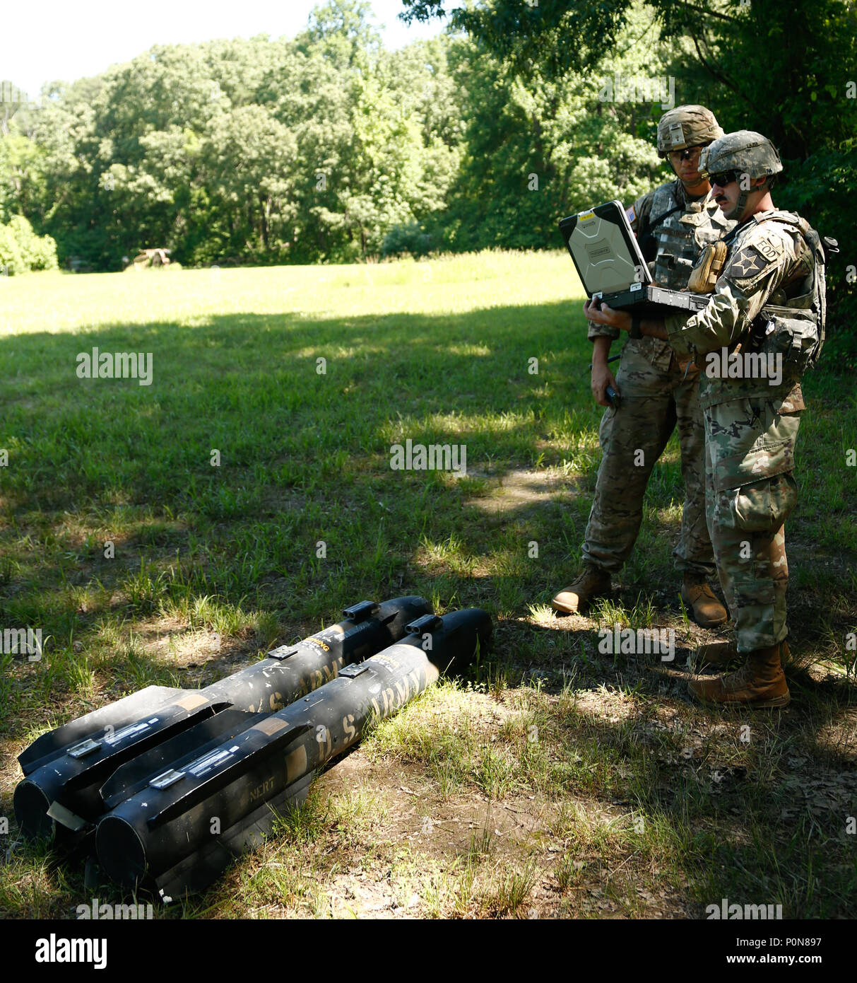 (From left) Staff Sgt. Edward Monczynski, an explosive ordnance ...