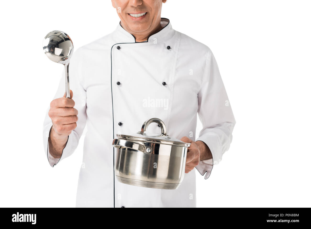 Close-up view of pan and ladle in chef hands isolated on white Stock ...