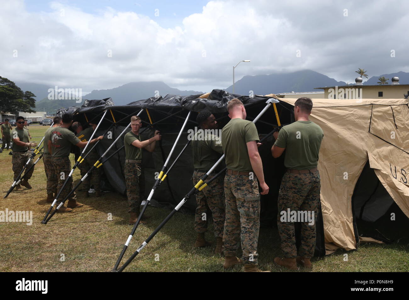 U.S. Marines with 1st Battalion, 3rd Marine Regiment, set up tents at ...
