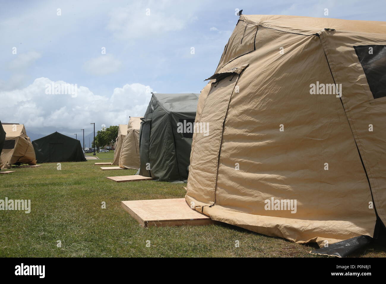 U.S. Marines with 1st Battalion, 3rd Marine Regiment, set up tents at ...