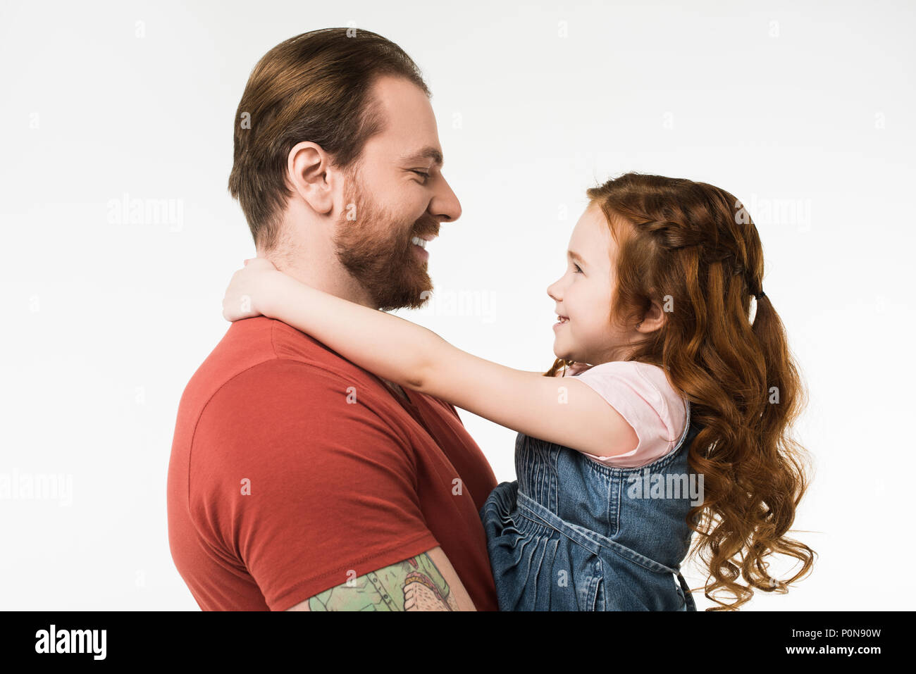 Side view of smiling father and daughter isolated on white Stock Photo ...