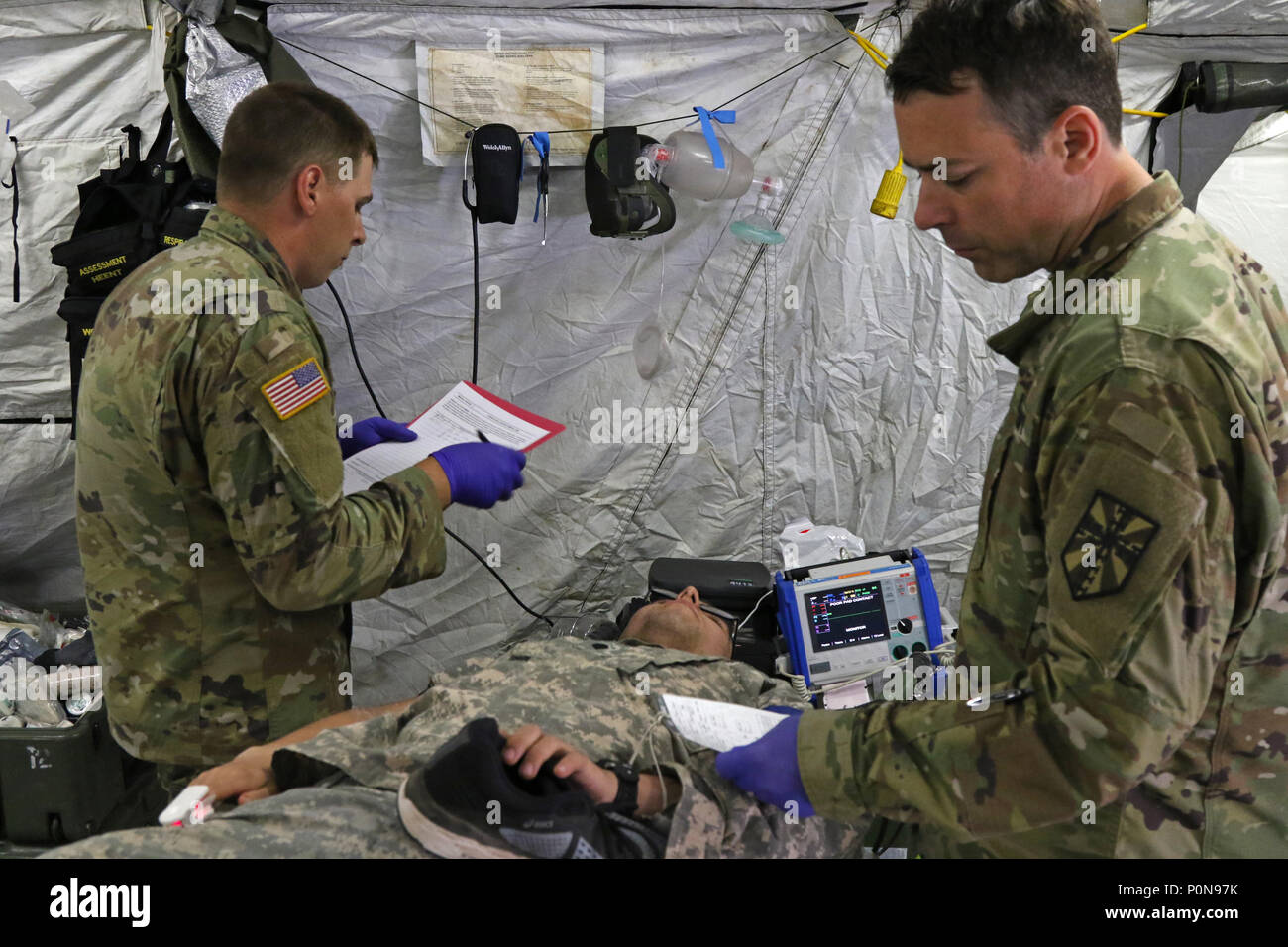 Sgt. Scott Stinebaugh, healthcare specialist, and Capt. Mark Glotkowski ...