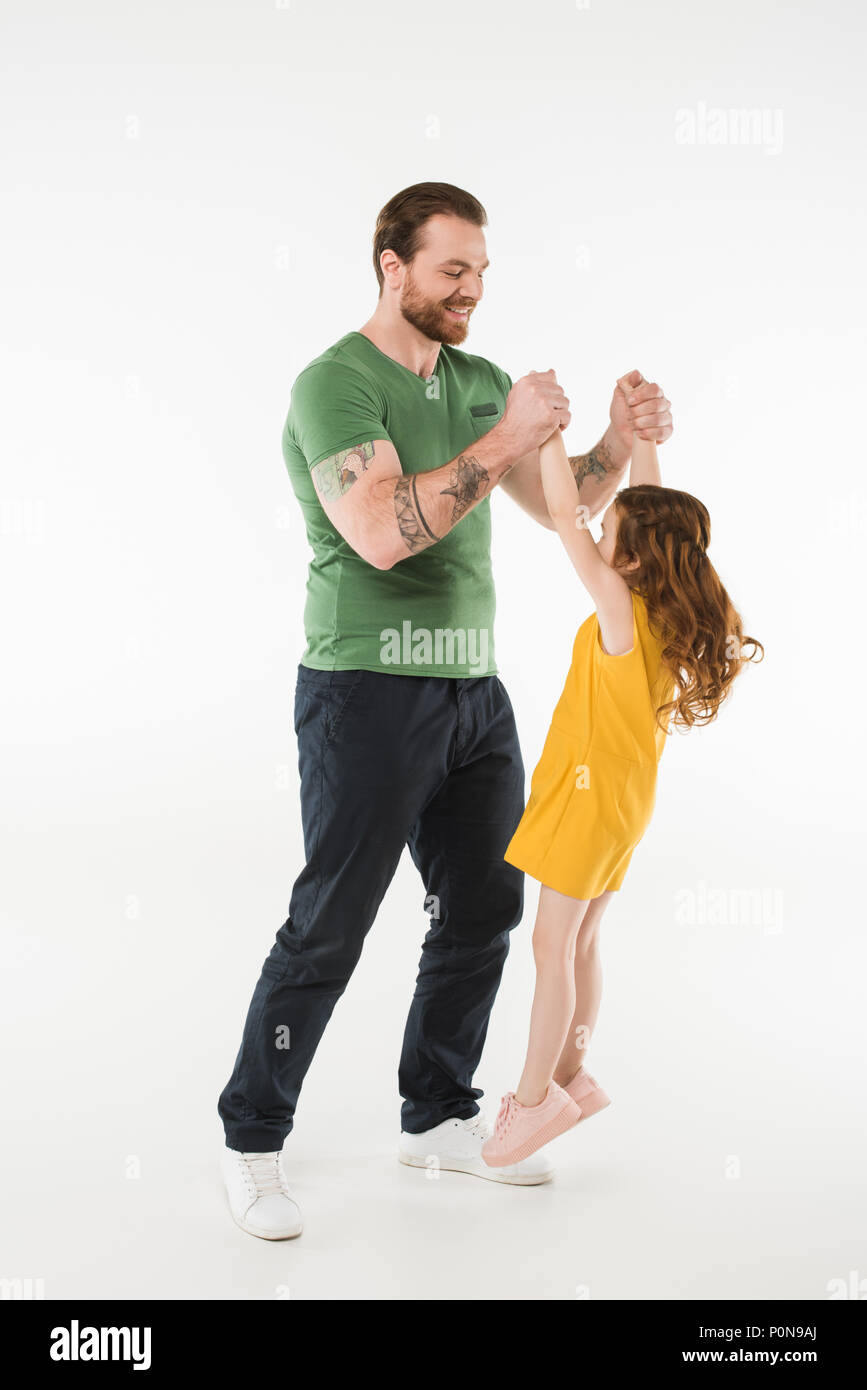 Father raising little daughter isolated on white Stock Photo - Alamy