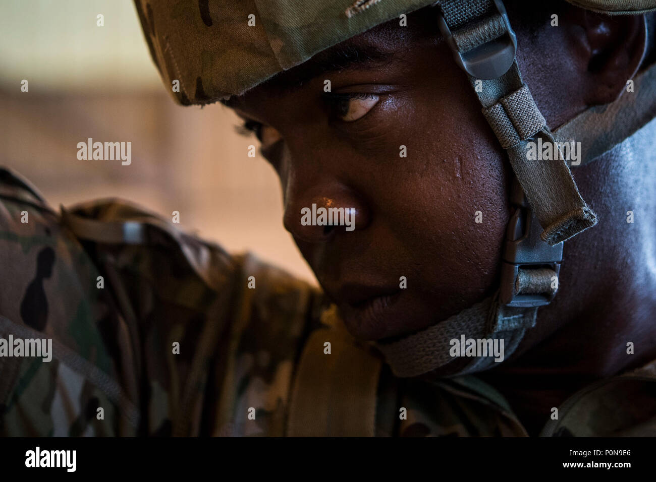 U.S. Army Sgt. Kerwin Fenn adjusts his gear in preparation for the D ...