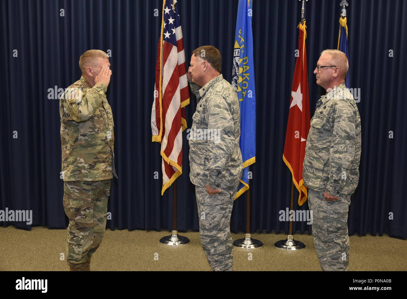 U.S. Army Maj. Gen. Timothy A. Reisch, left, presided over the ceremony ...