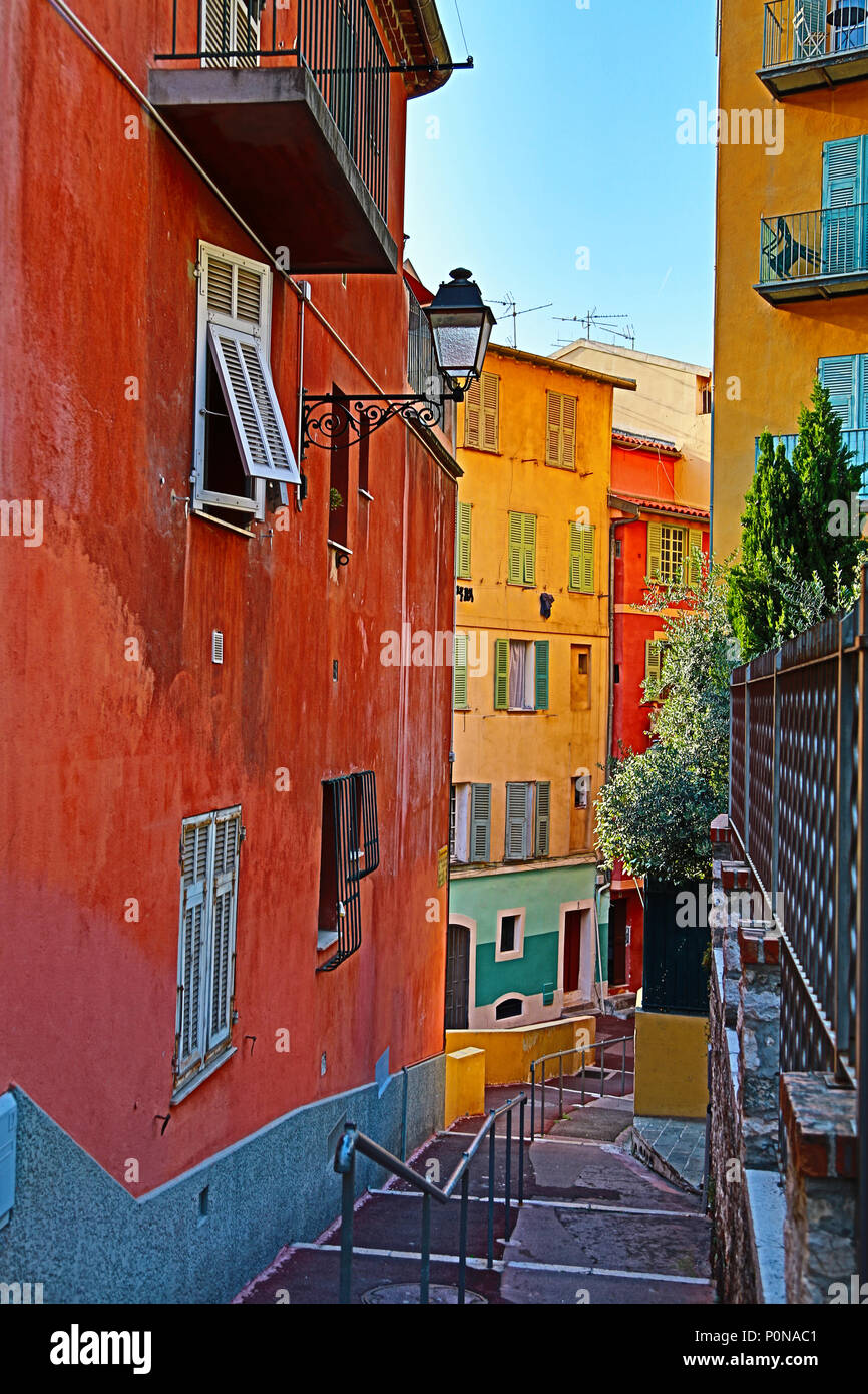 Narrow charming street, step ladder and old colorful buildings in Nice ...